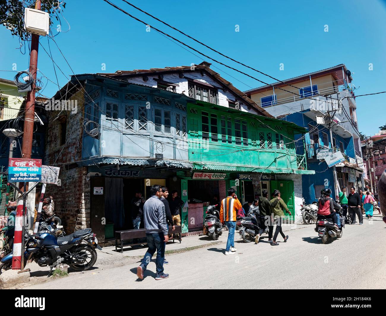 Traditional Himalayan building used as hotel and shops on city road ...