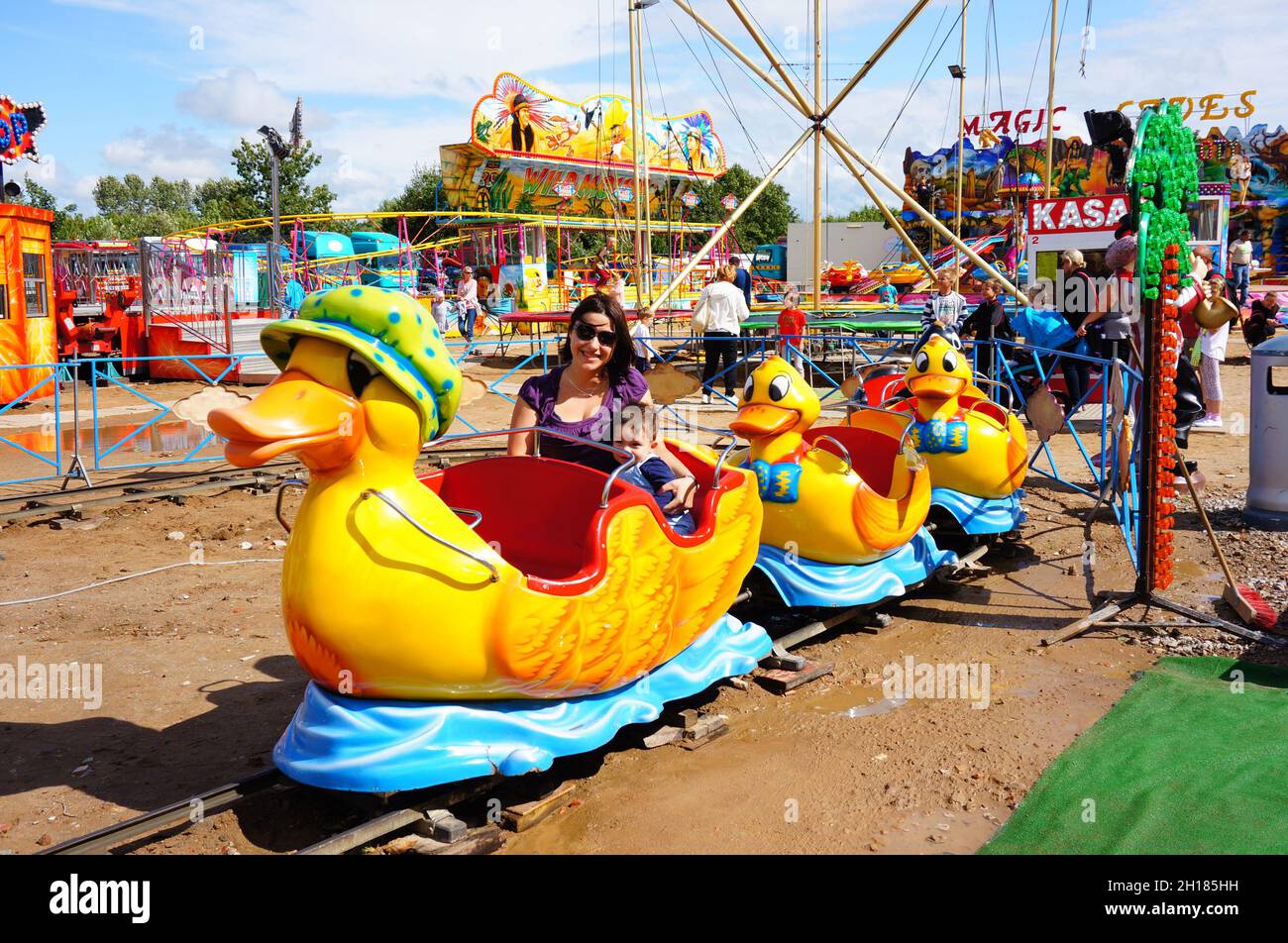USTRONIE MORSKIE, POLAND - Jul 20, 2015: The mother and child on a duck ...