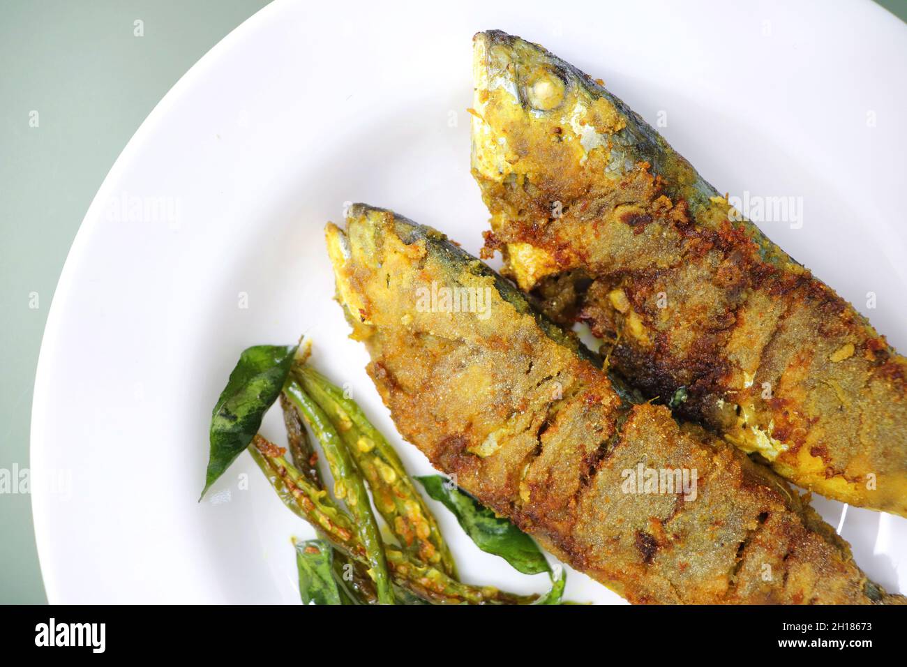 Indian Mackerel fish fry. Bangda Rava fry. whole Fried fish served on a ...