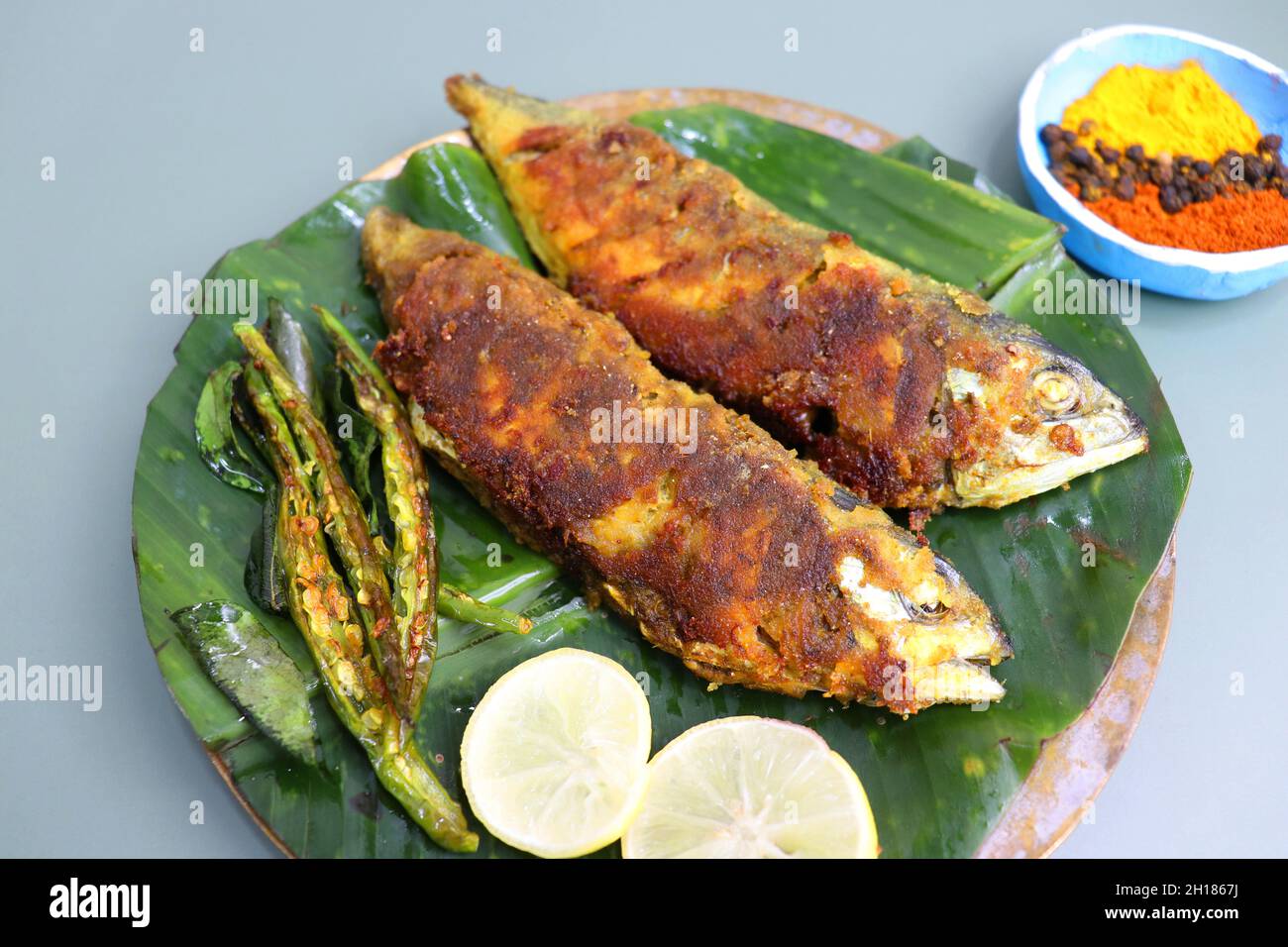 Indian Mackerel fish fry. Bangda Rava fry. whole Fried fish served on a ...