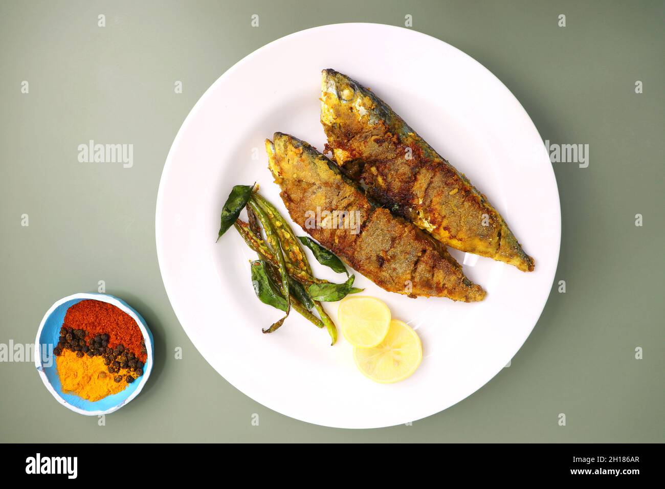 Indian Mackerel fish fry. Bangda Rava fry. whole Fried fish served on a ...