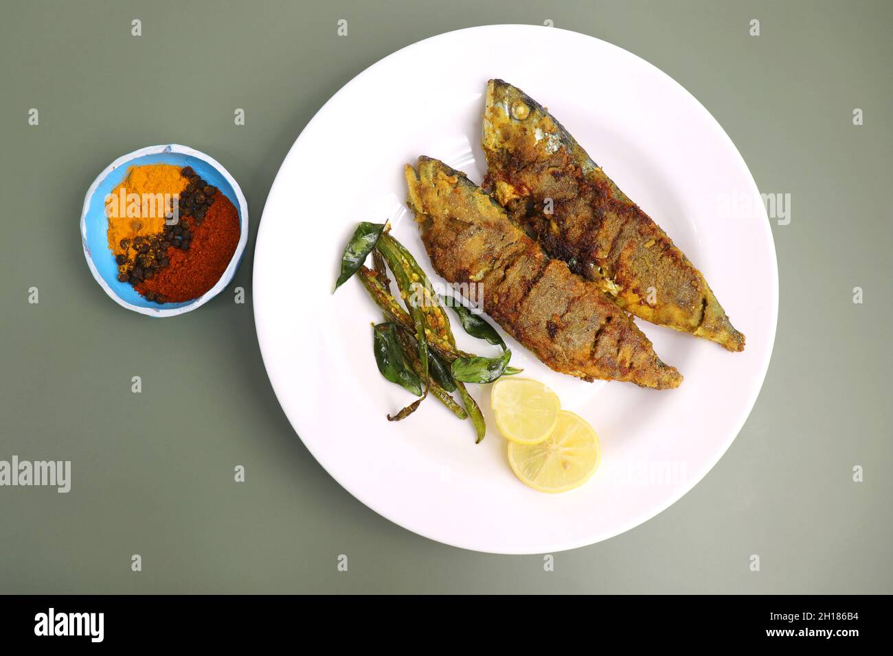 Indian Mackerel fish fry. Bangda Rava fry. whole Fried fish served on a ...