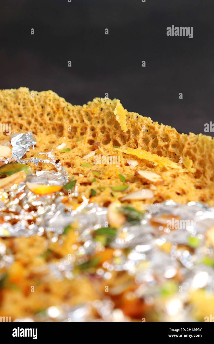 Rajasthani Ghevar. Ghewar is an Indian crunchy sweet dish made using ...