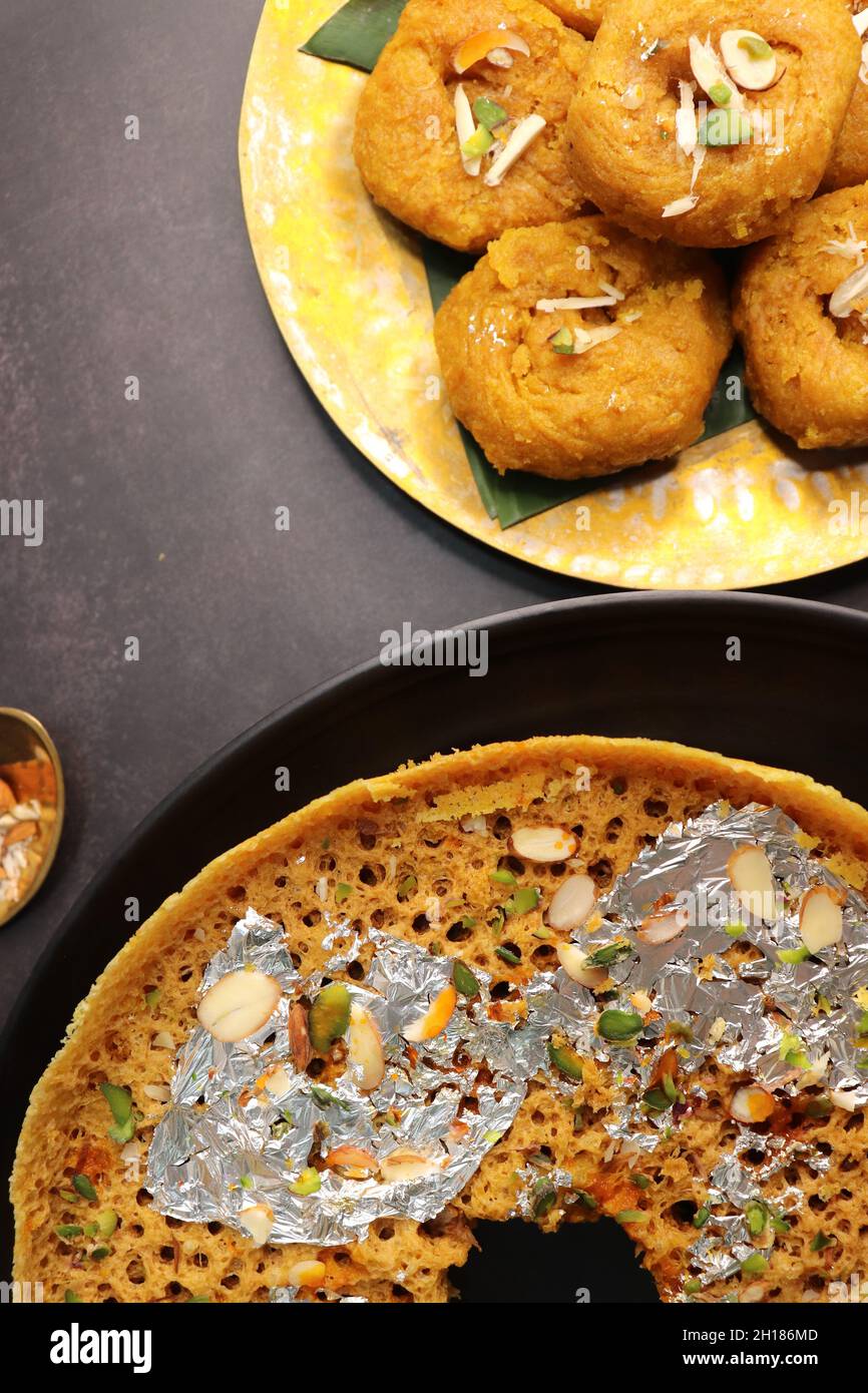 Rajasthani Ghevar. Ghewar is an Indian crunchy sweet dish made using ...