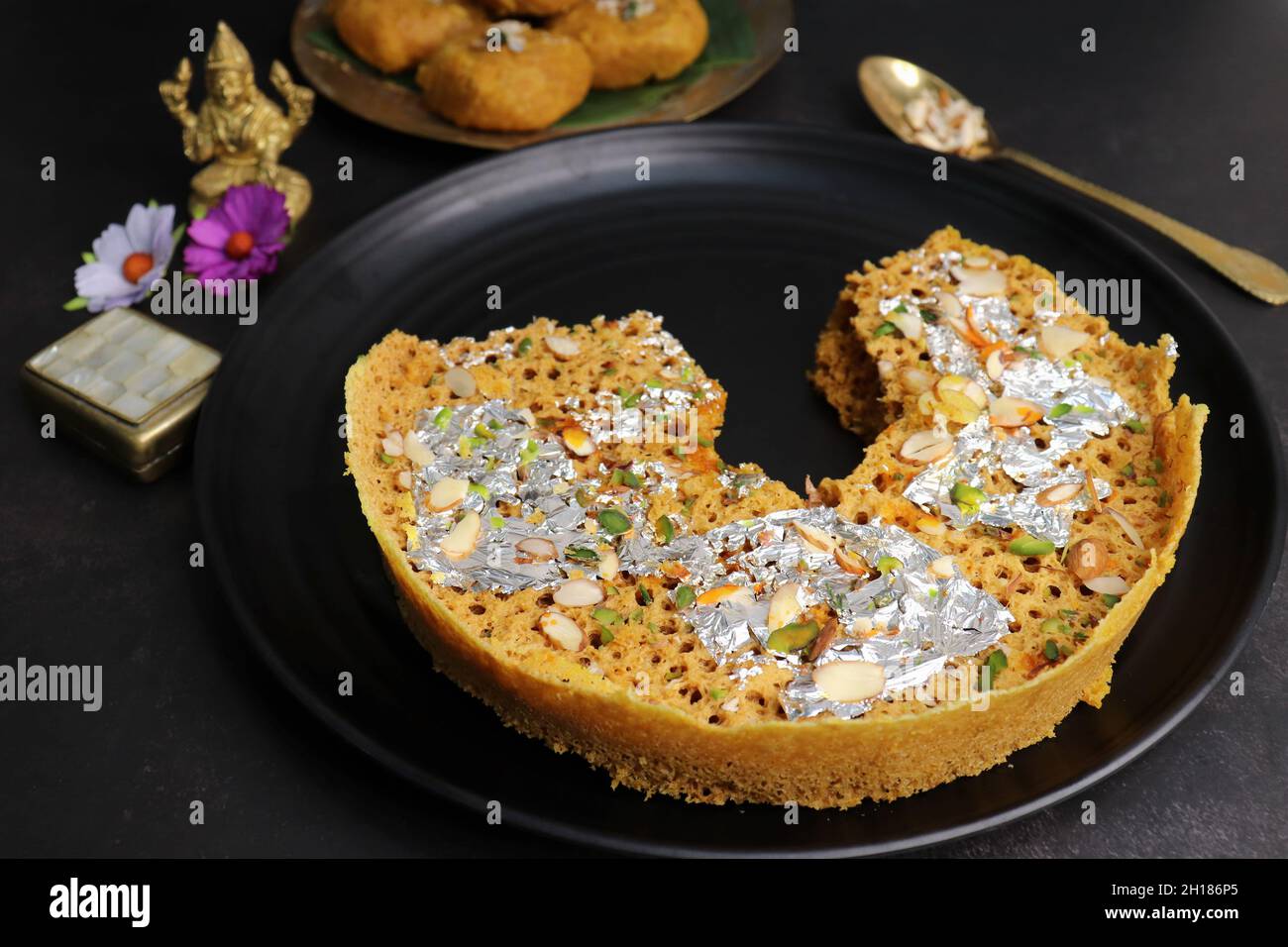 Rajasthani Ghevar. Ghewar is an Indian crunchy sweet dish made using ...