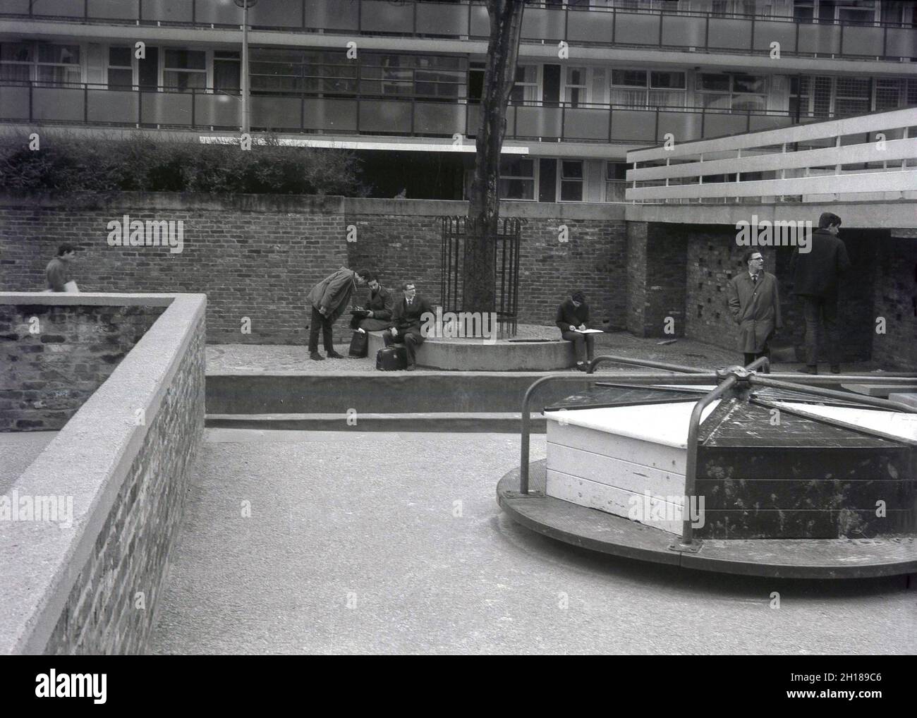 1960s, historical, a concrete and walled playground area, at a large ...