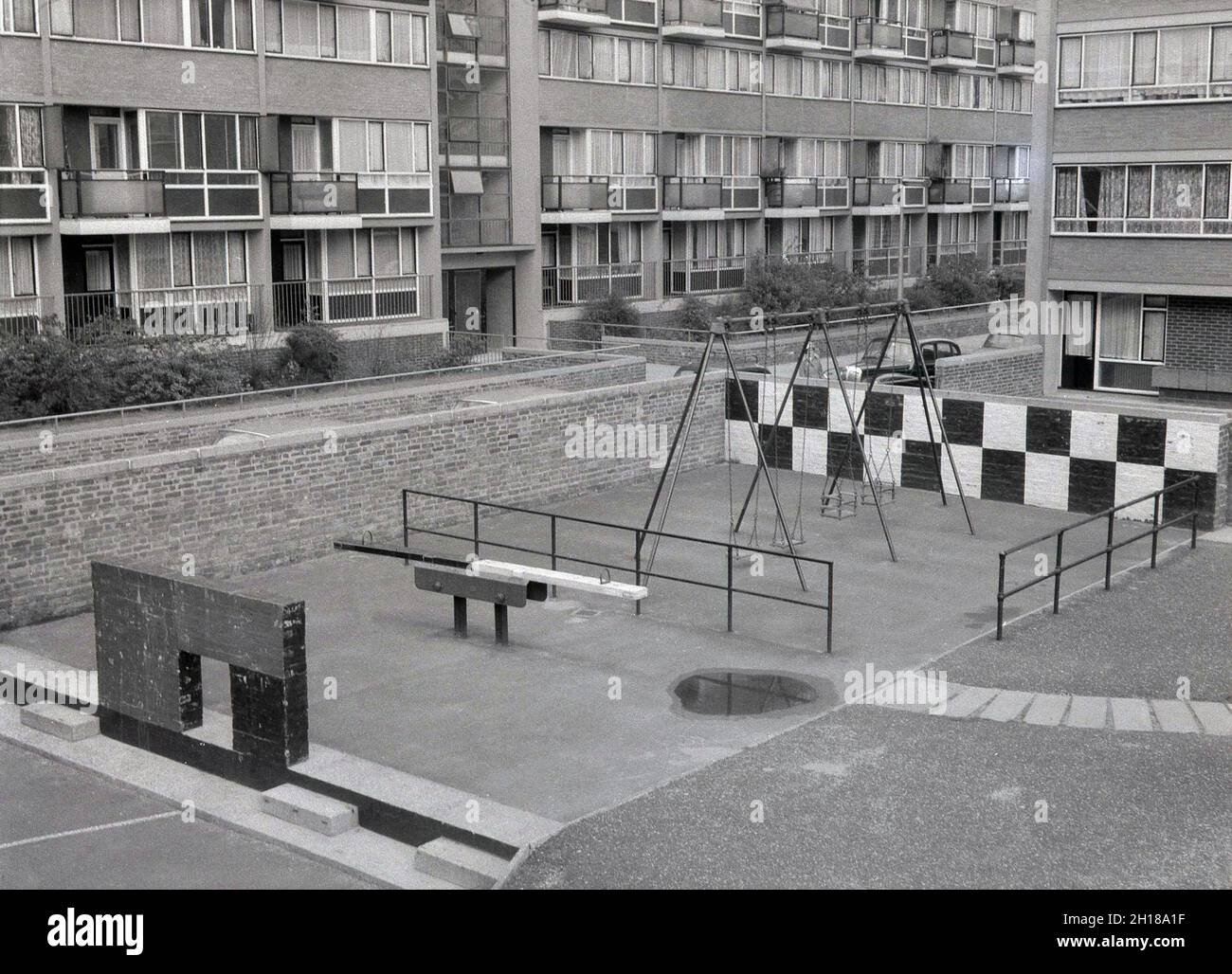 1960s, historical, a concrete and walled playground area, at a large ...