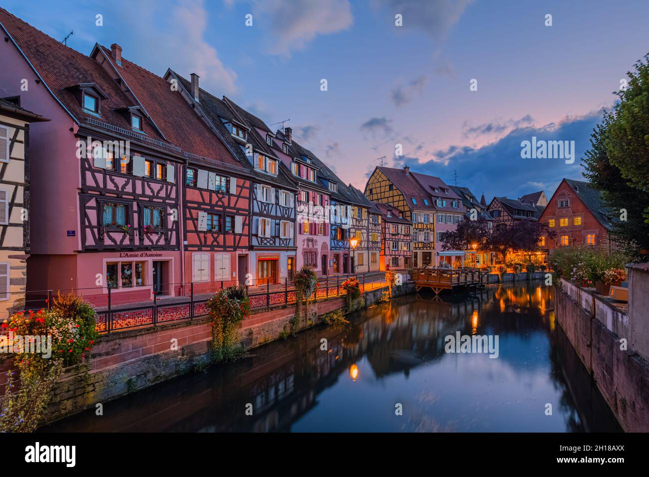 An evening at Colmar, with traditional colorful half-timbered houses in ...