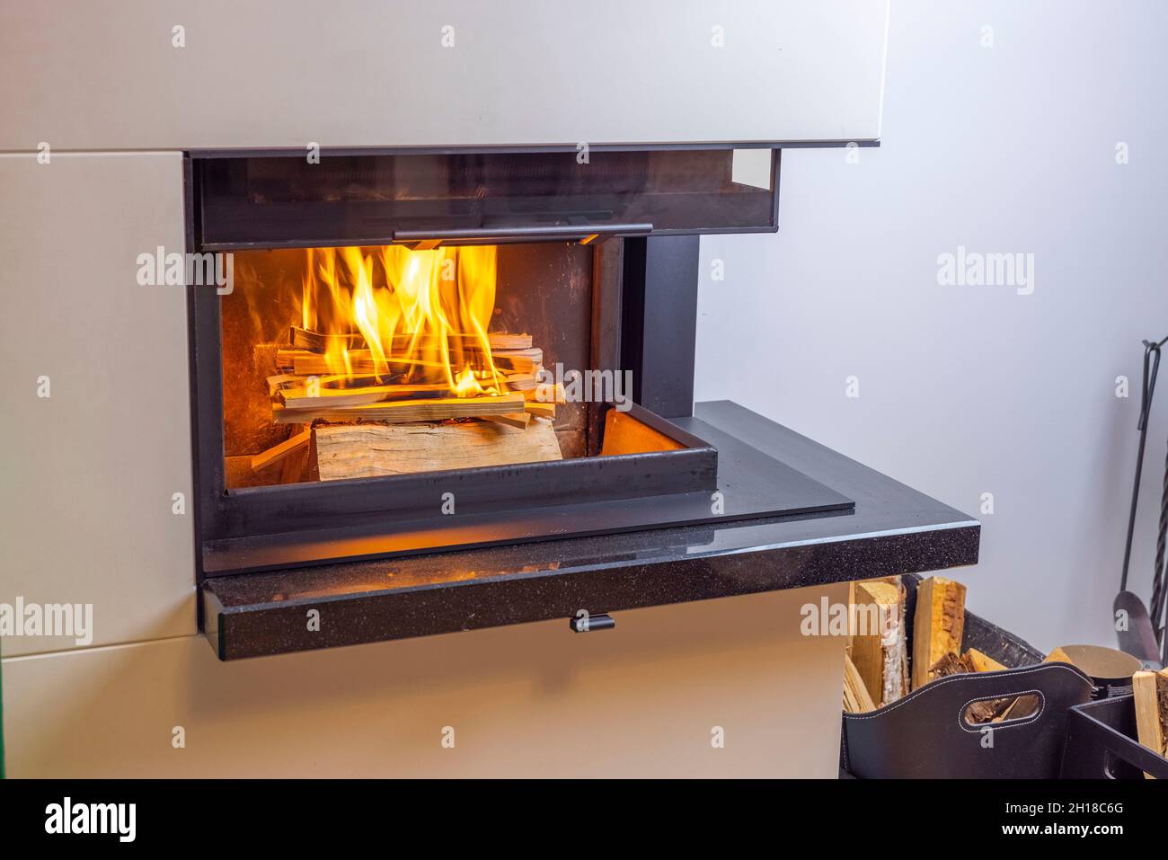 Beautiful view of interior of modern fireplace in living room. View of ...