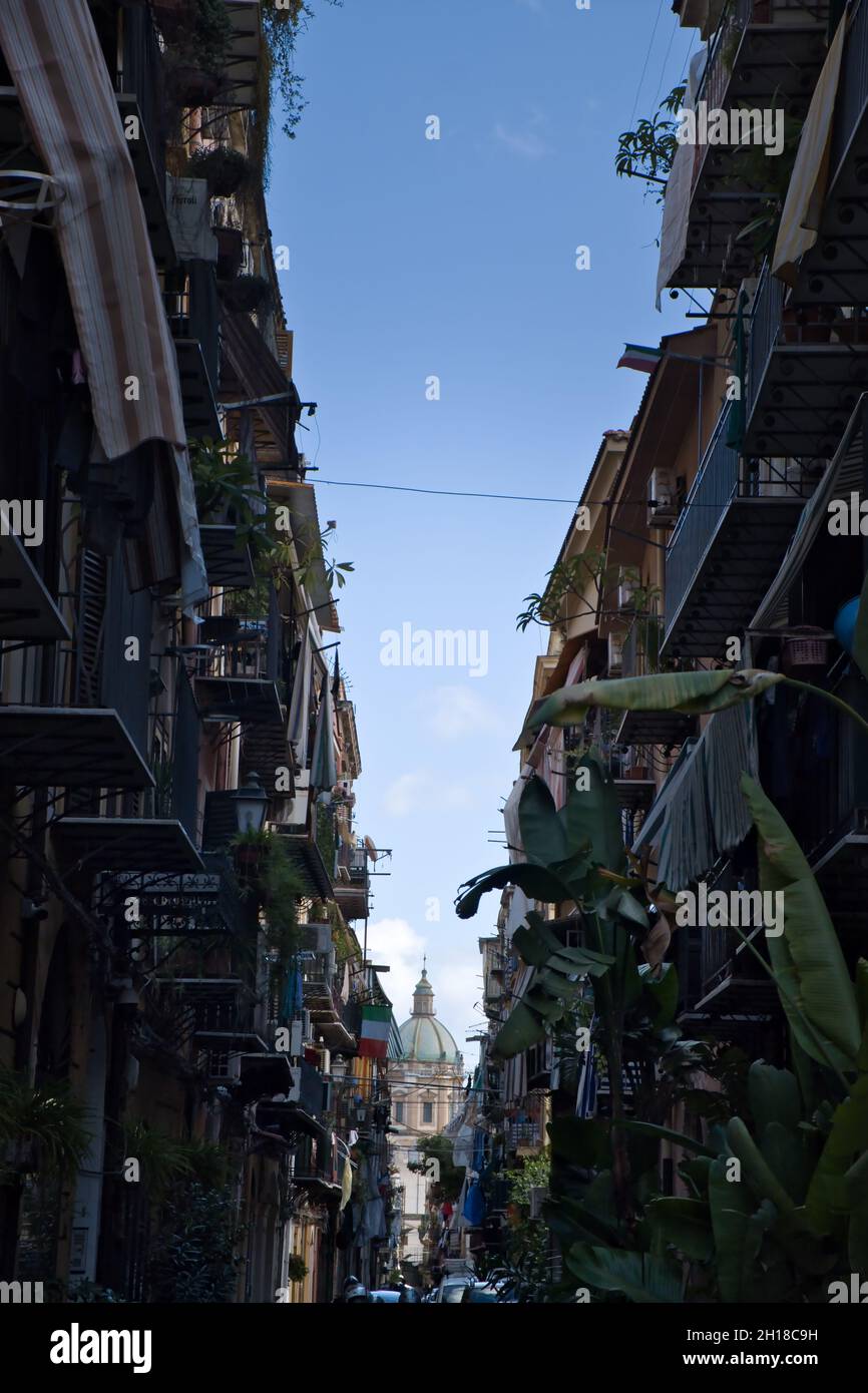 Typical street view, with a church dome at the end, in Palermo Stock ...