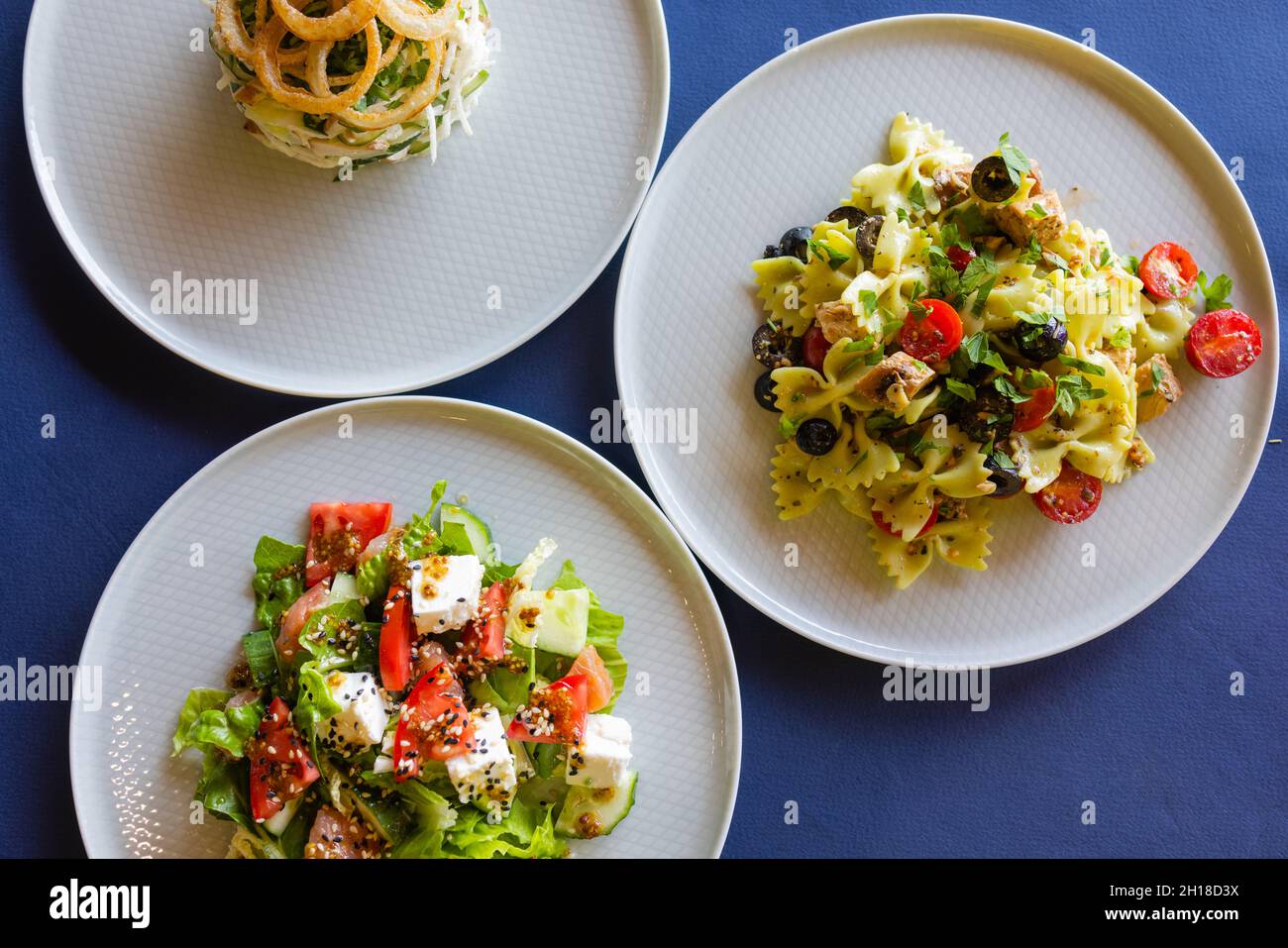 table with many salad top view. Different salads on concrete table, top ...