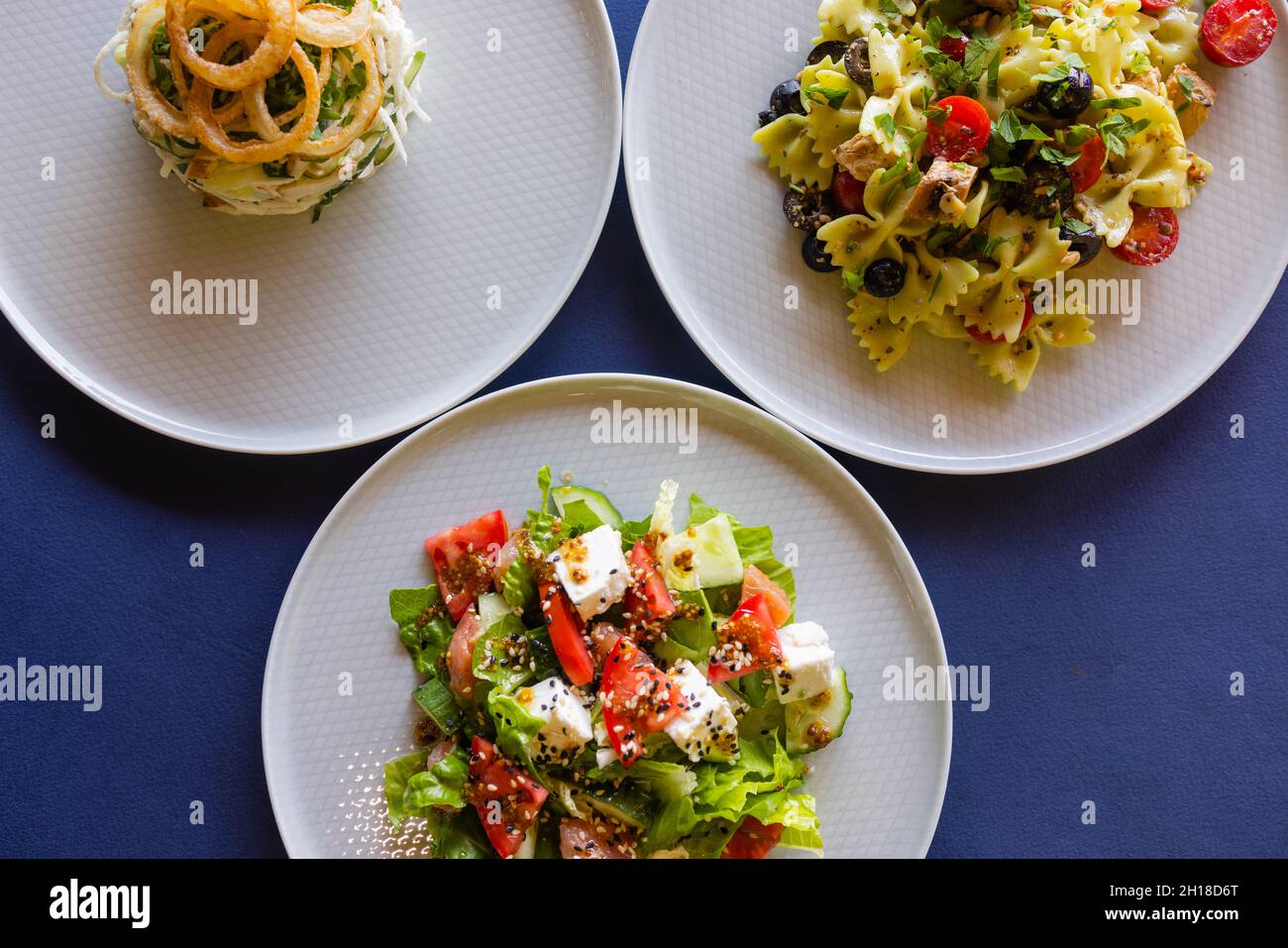 table with many salad top view. Different salads on concrete table, top ...