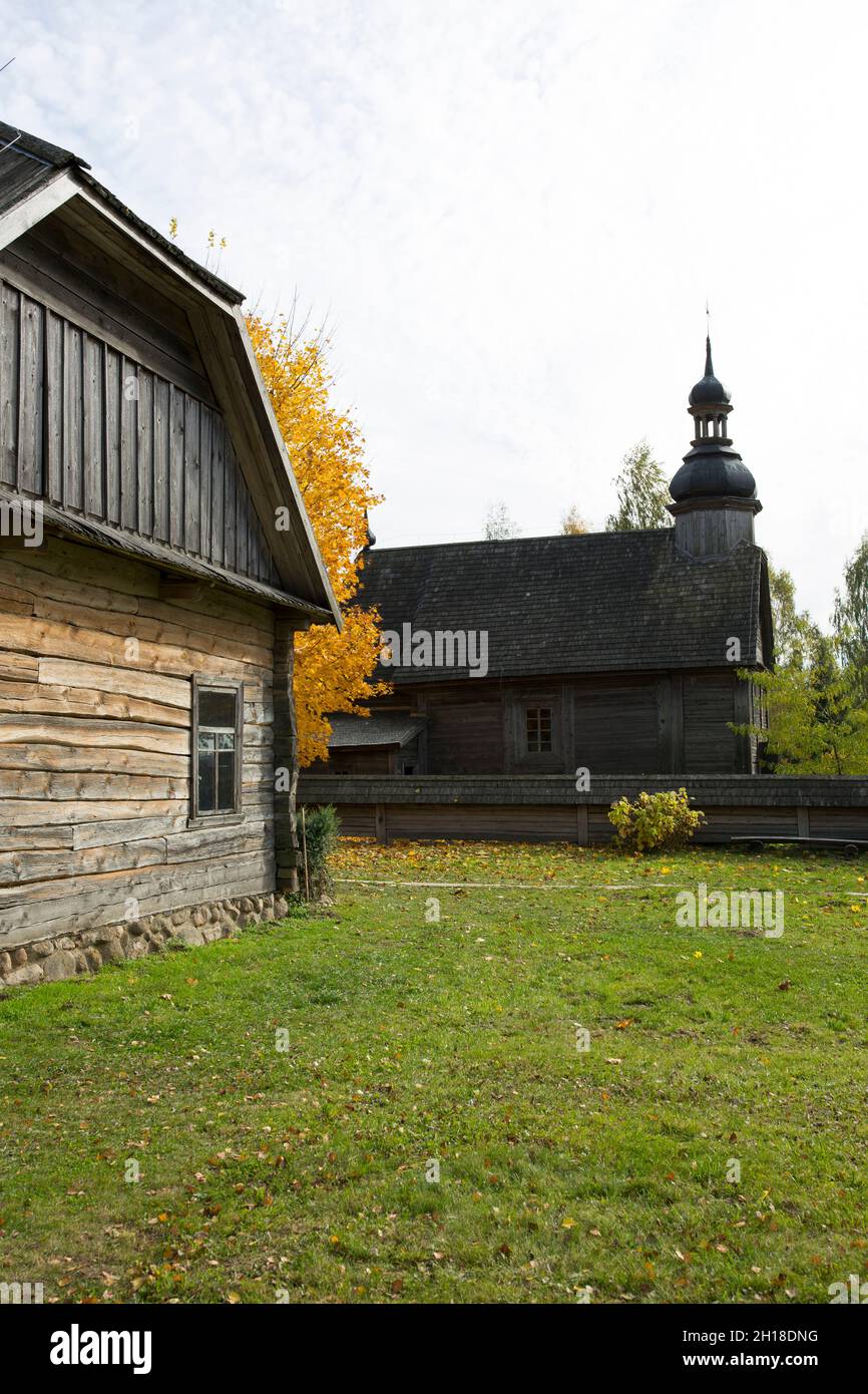 An old rustic wooden hut. In the background there is a rustic wooden ...