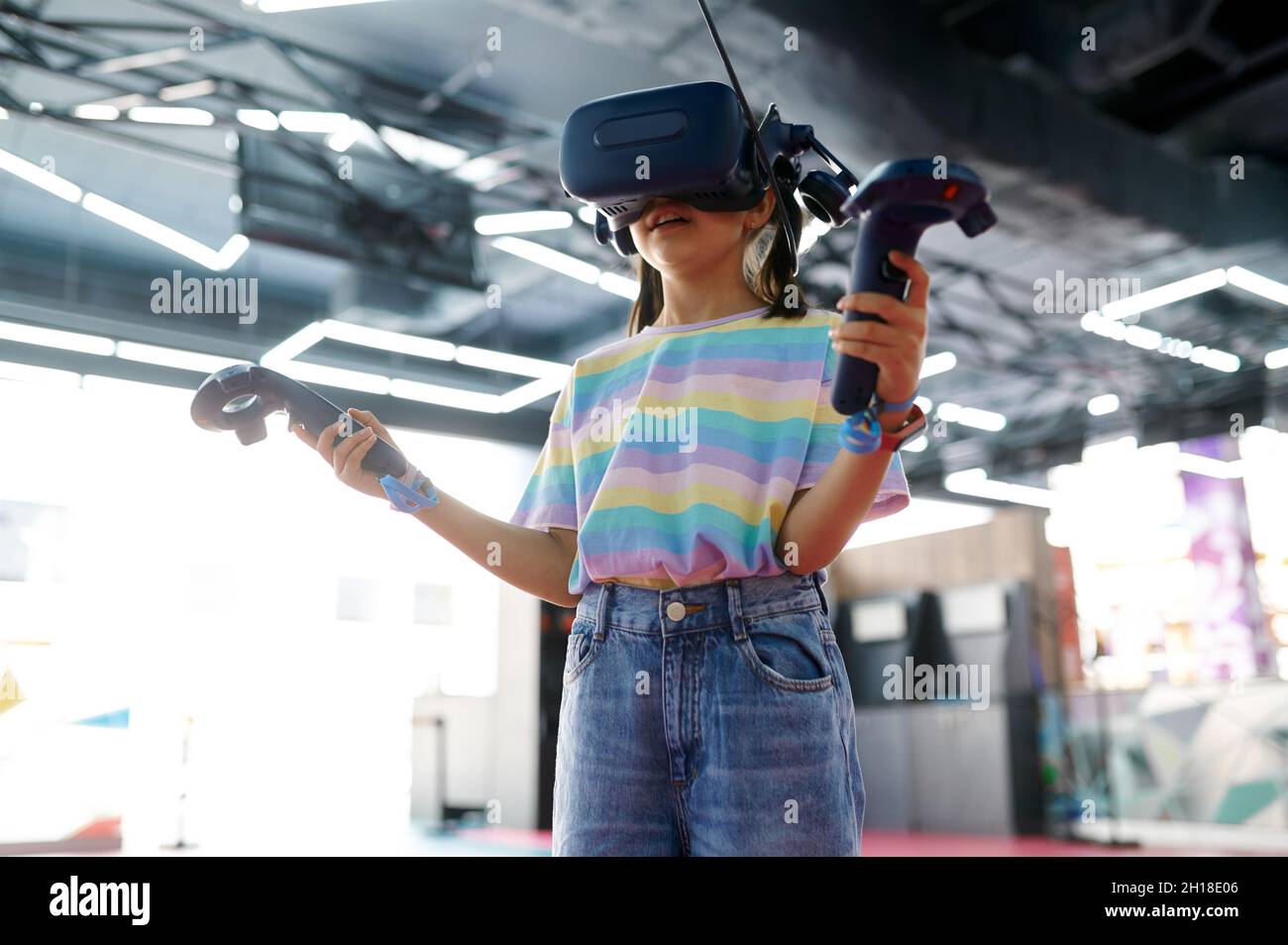 Little girl in virtual reality glasses, playground Stock Photo - Alamy