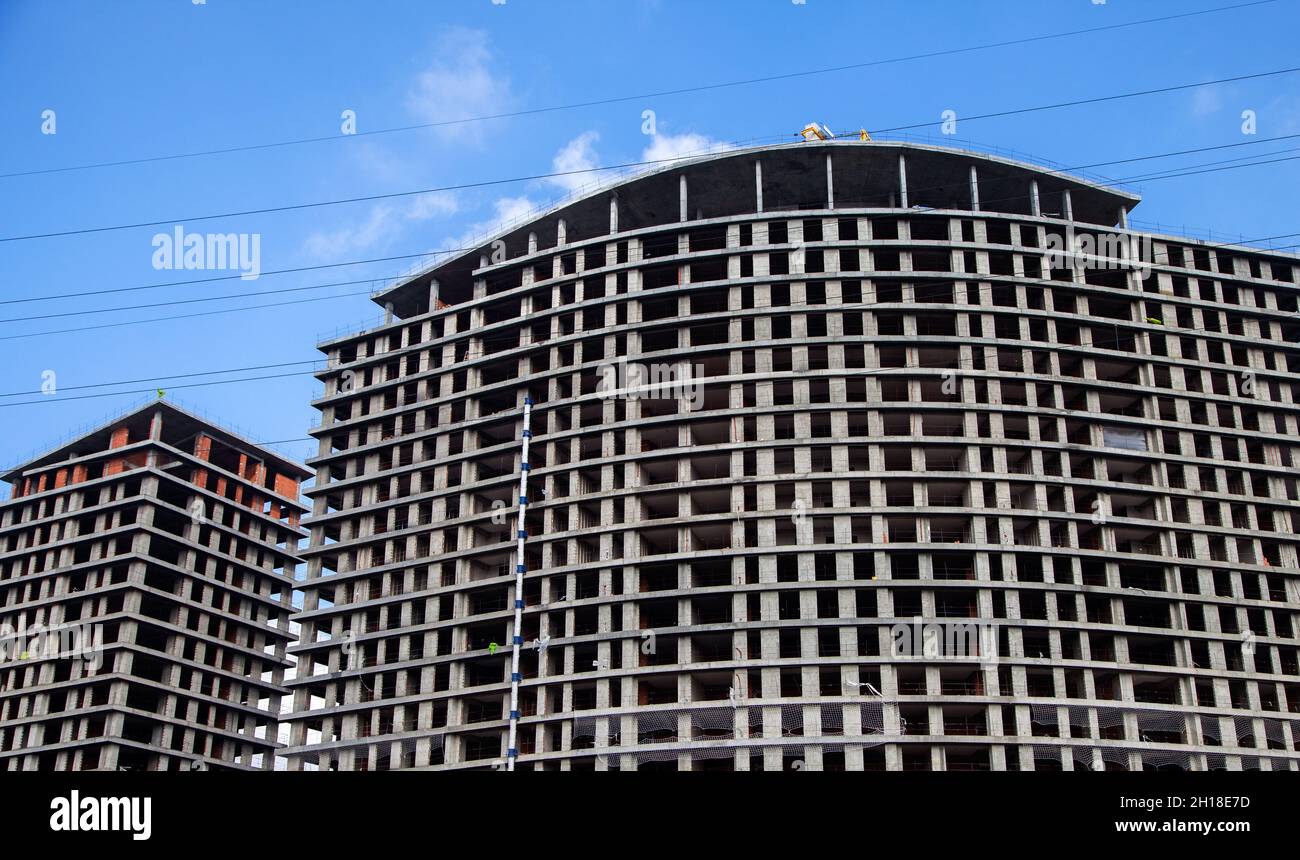 Unfinished cement building front view at a construction site Stock ...