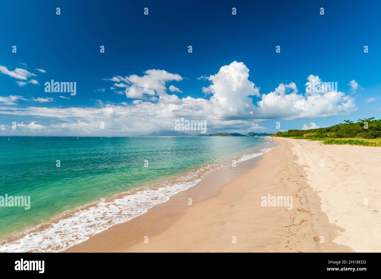 The miles long Pinney's Beach fronting the Caribbean Sea. Nevis, Saint ...