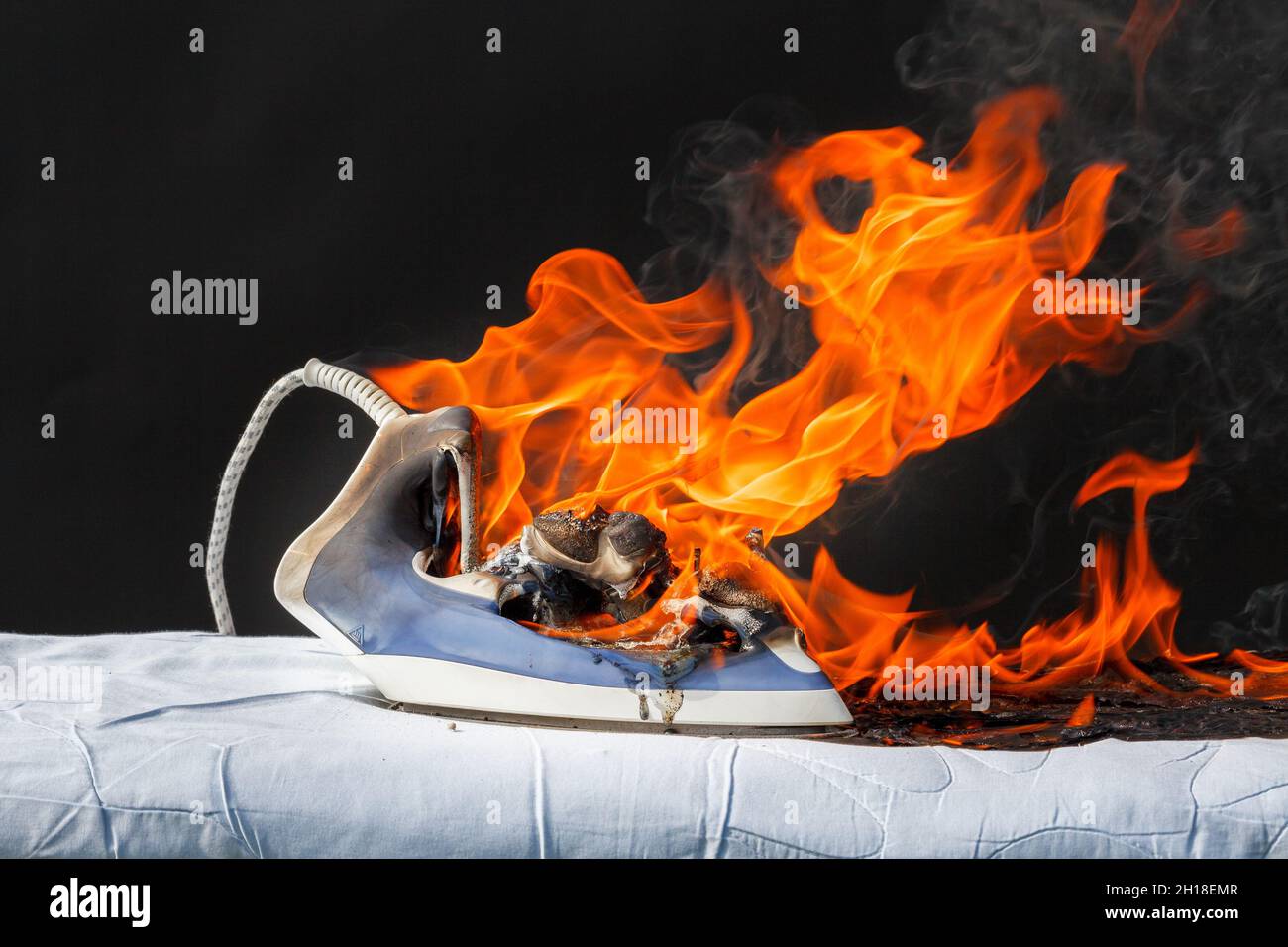 On the ironing board fire caused by faulty electrical wiring Stock ...