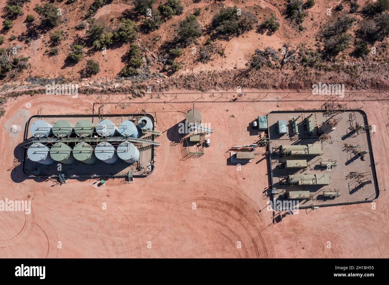 An oil storage tank battery and separating equipment on an oil well location in Utah Stock Photo ...