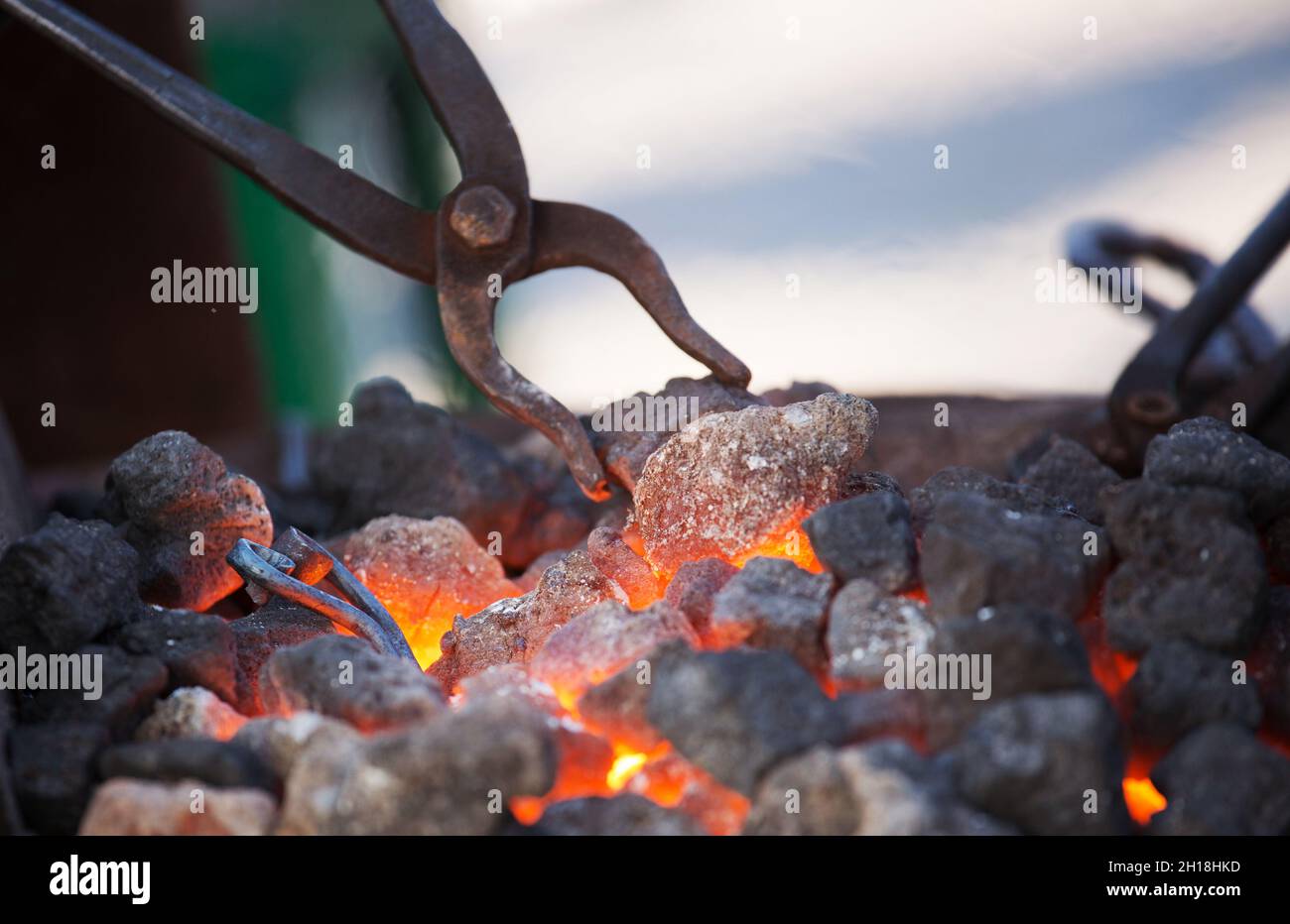 Old fashioned blacksmith furnace with burning coals Stock Photo - Alamy