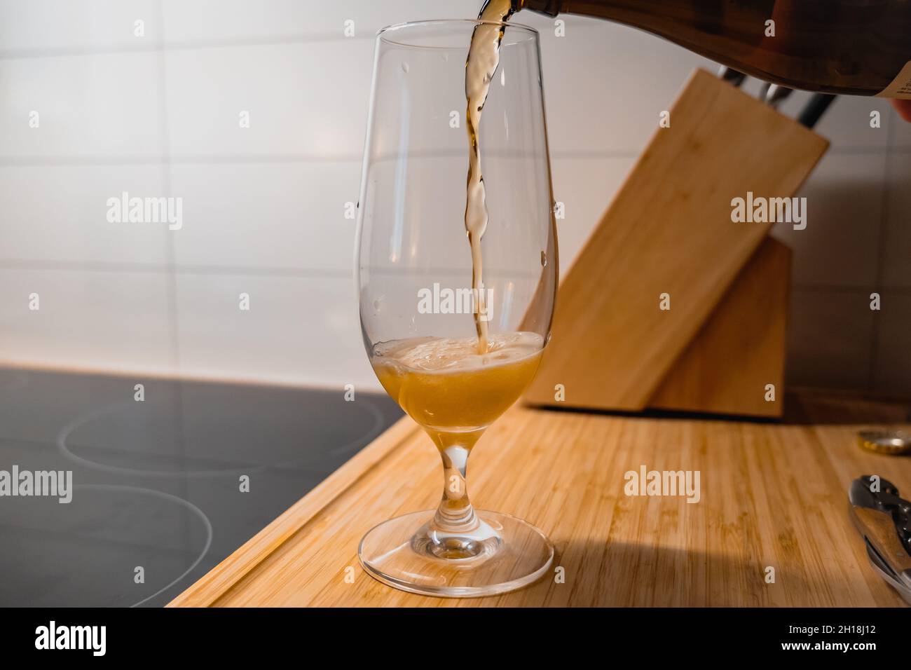 Pouring a pint of lager, beer Stock Photo - Alamy