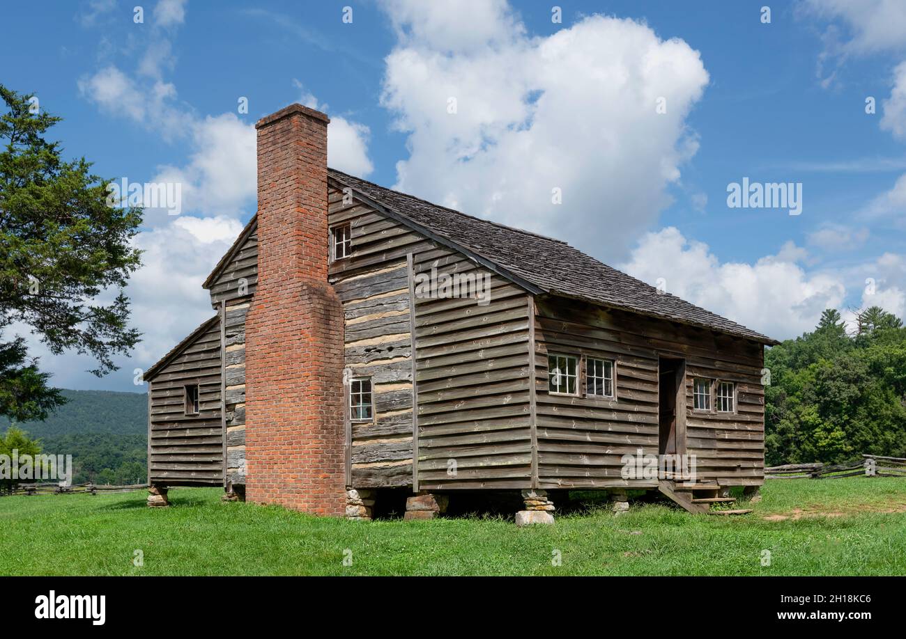 Disused early pioneer timber homestead and brick fire stack in the ...