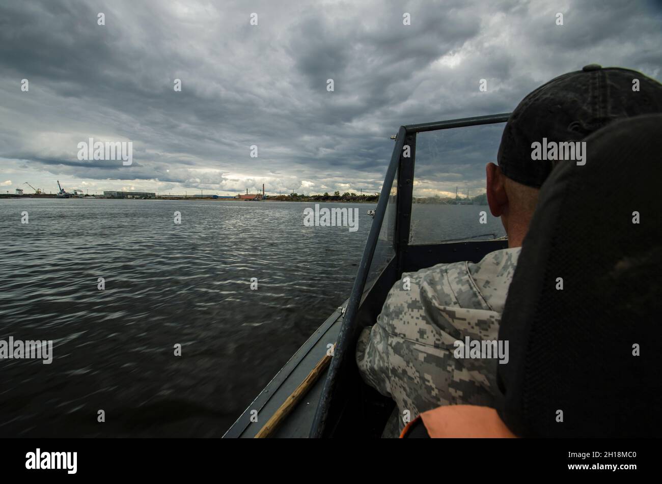 The navigator. Boat driver on the river Stock Photo - Alamy