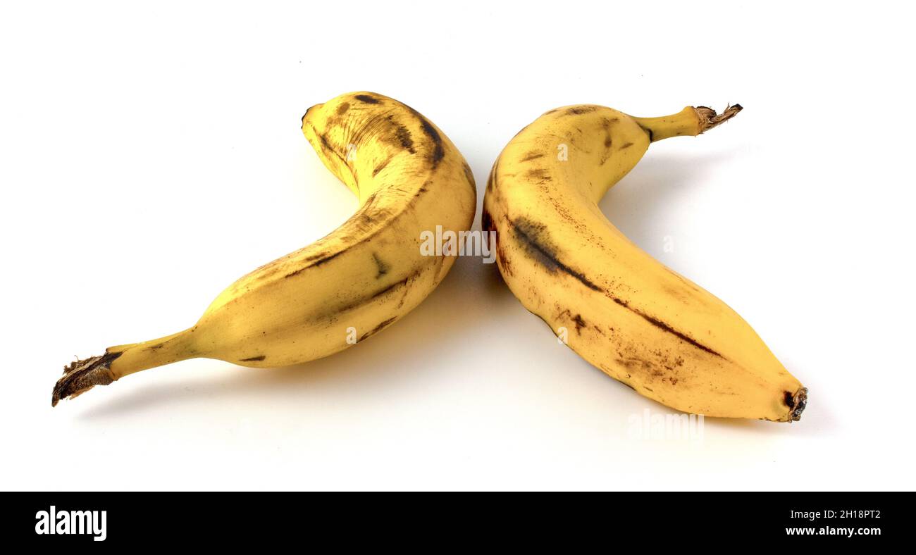 Ripe bananas isolated on white background. Fruits with dark spots that ...