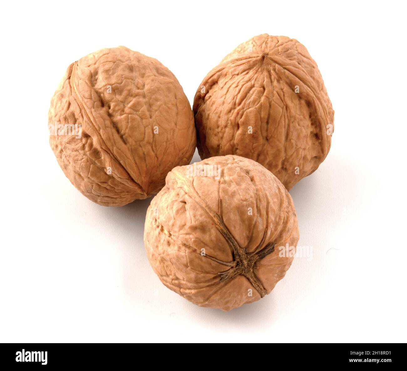 Three walnuts isolated on white background Stock Photo - Alamy