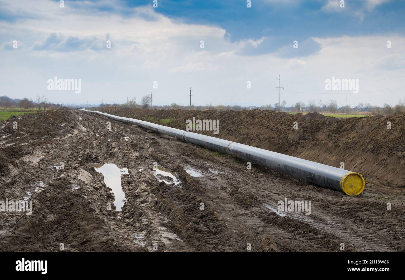 Natural gas pipeline construction work. A dug trench in the ground for ...