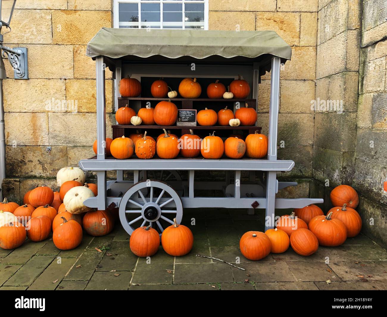 An old-fashioned farmers market Barrow stall selling varieties of ...