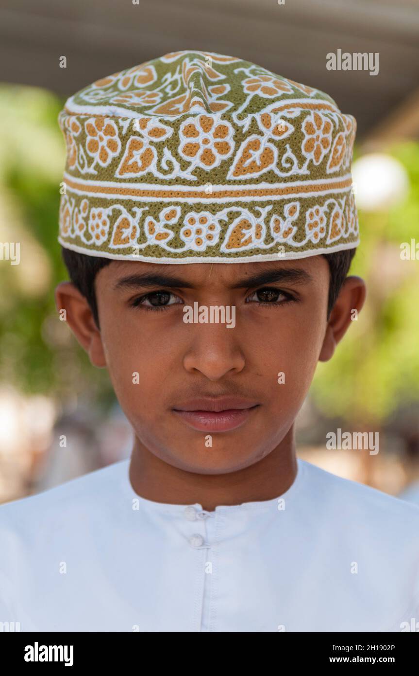 Portrait of a young boy at Nizwa cattle market. Nizwa, Oman Stock Photo ...