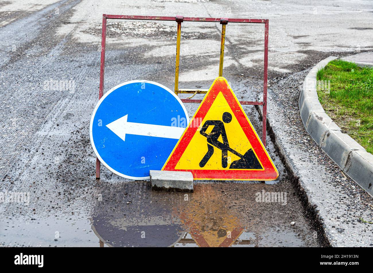 Road works traffic sign at the city street. Under construction road ...