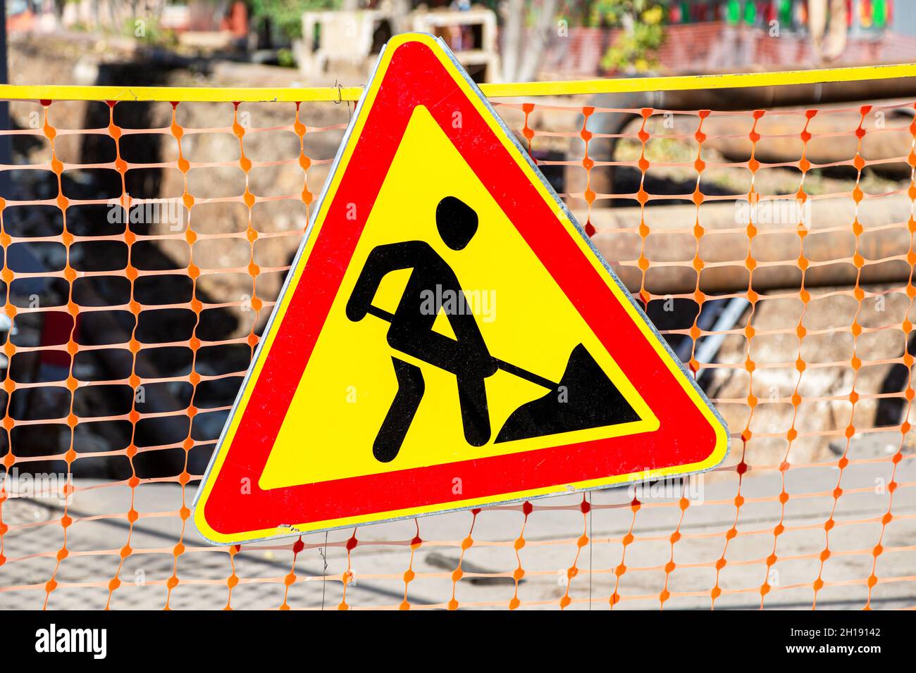 Road works traffic sign at the city street. Under construction road ...