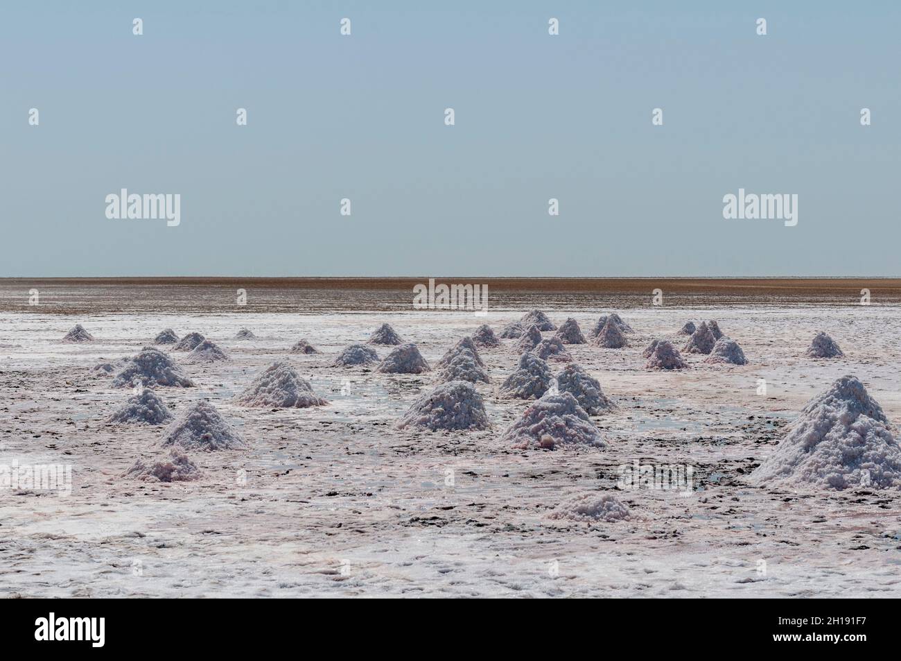 Piles of salt harvest in the salt flats near Shannah. Shannah, Oman ...