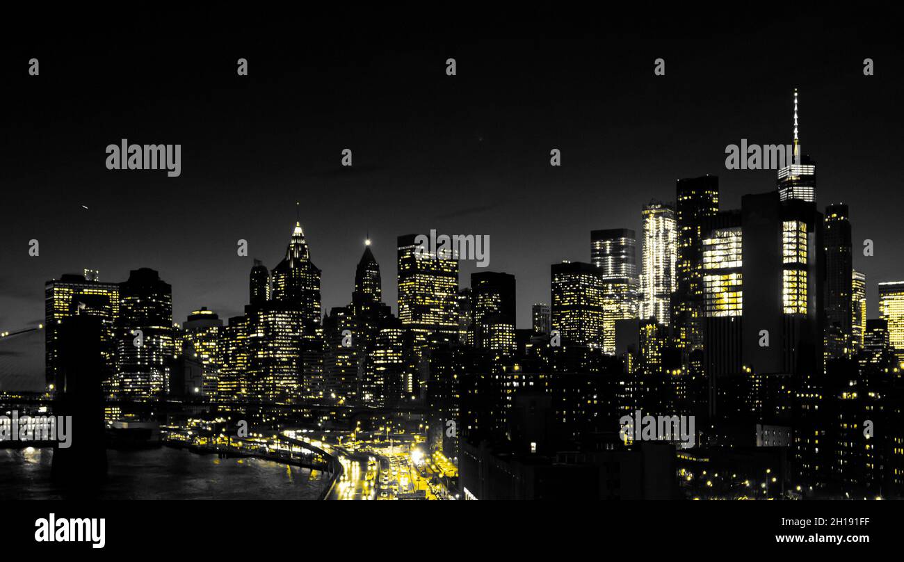 Red lights of Manhattan night skyline shining against a black and white ...