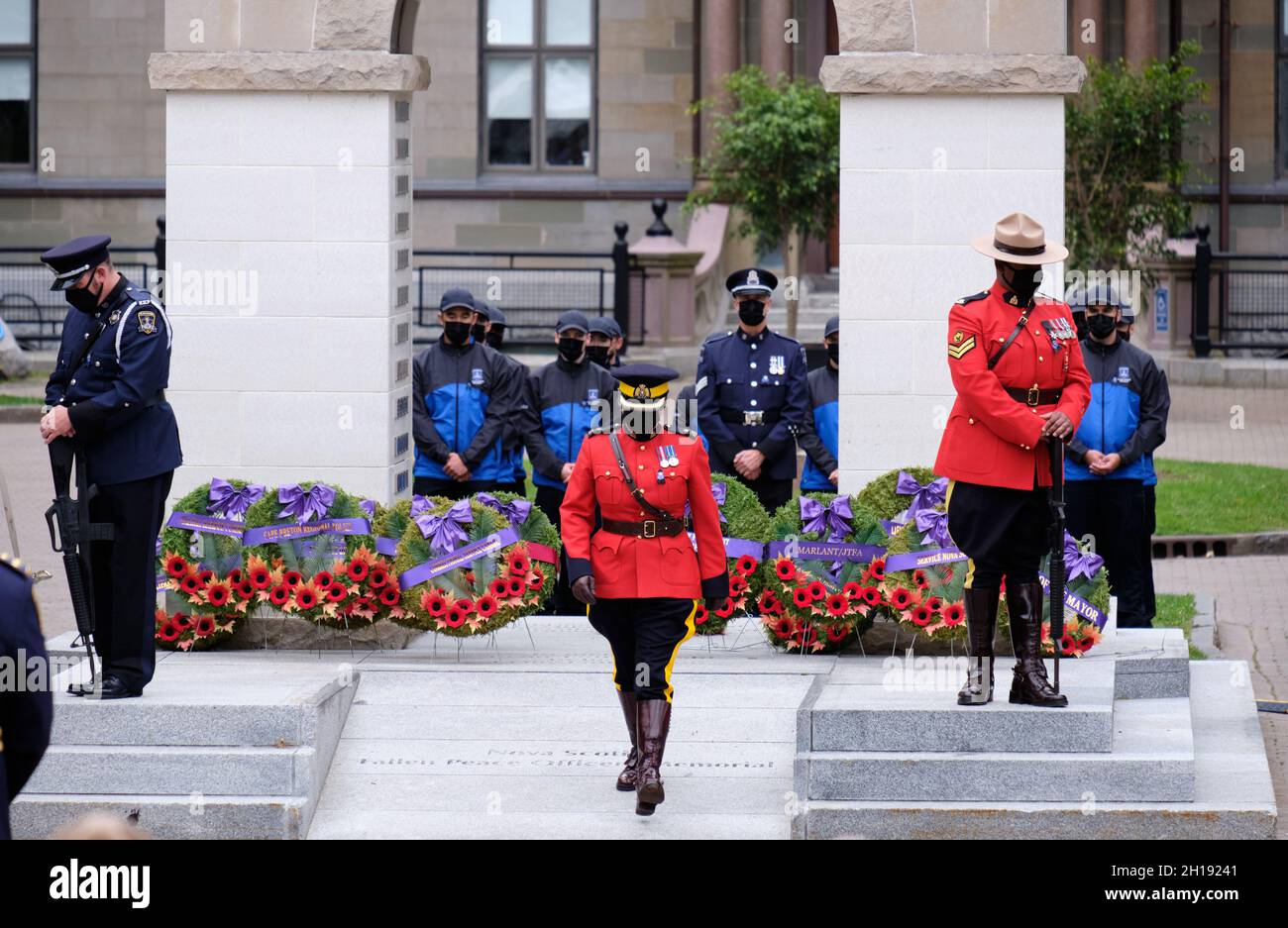 Halifax, Nova Scotia, Canada. October 17th, 2021. RCMP officers, lay a ...