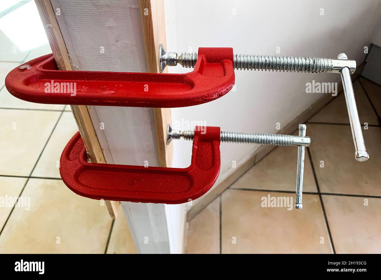 Clamps on a wall, renovation work in a private house, Lyon, France ...