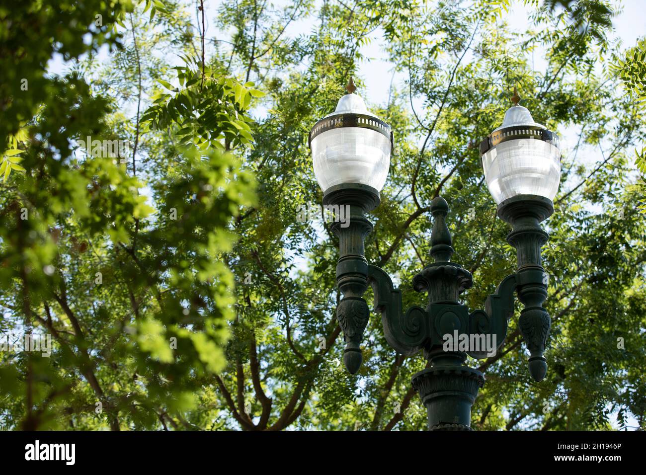 Shaded afternoon view of a historic street light in downtown Turlock ...