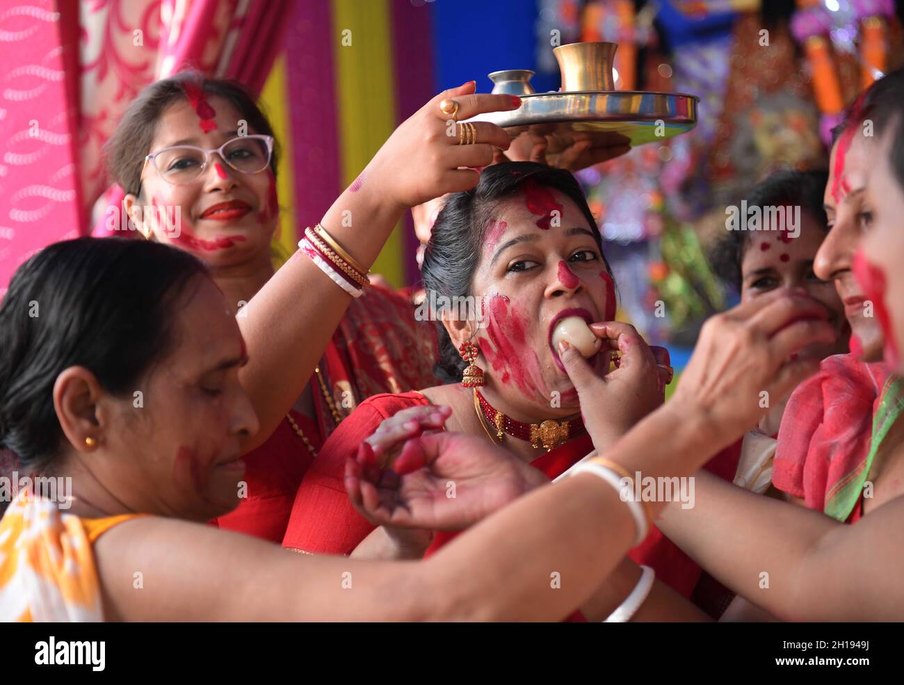 Married women devotees apply vermilion powder on each other and dance ...