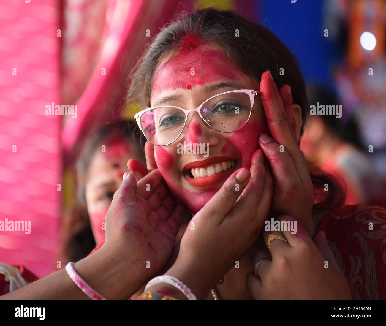 Married women devotees apply vermilion powder on each other and dance ...