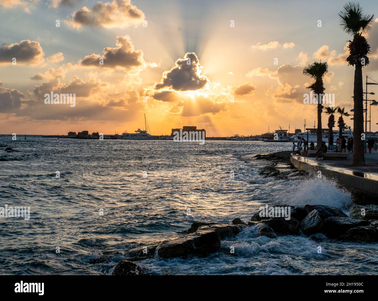 The sun sets behind Paphos Castle (fort) Paphos, Cyprus Stock Photo - Alamy