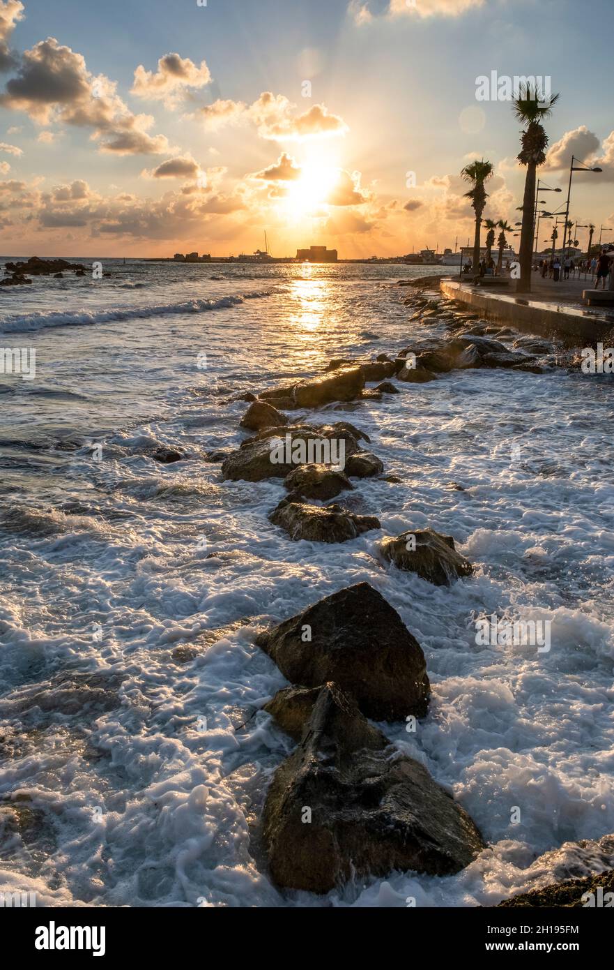 The sun sets behind Paphos Castle (fort) Paphos, Cyprus Stock Photo - Alamy