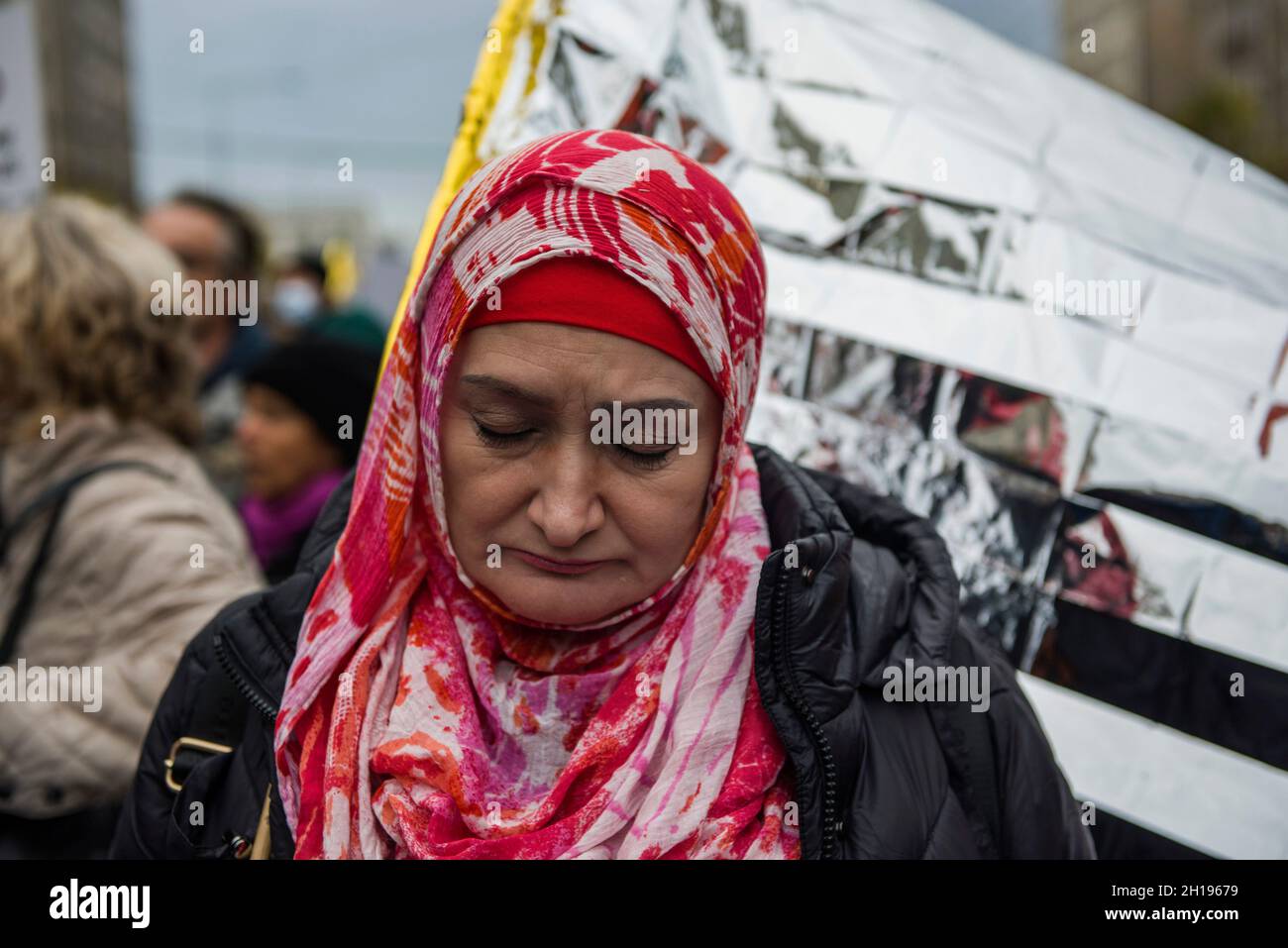 A Muslim woman gets emotional during a demonstration march at the ...