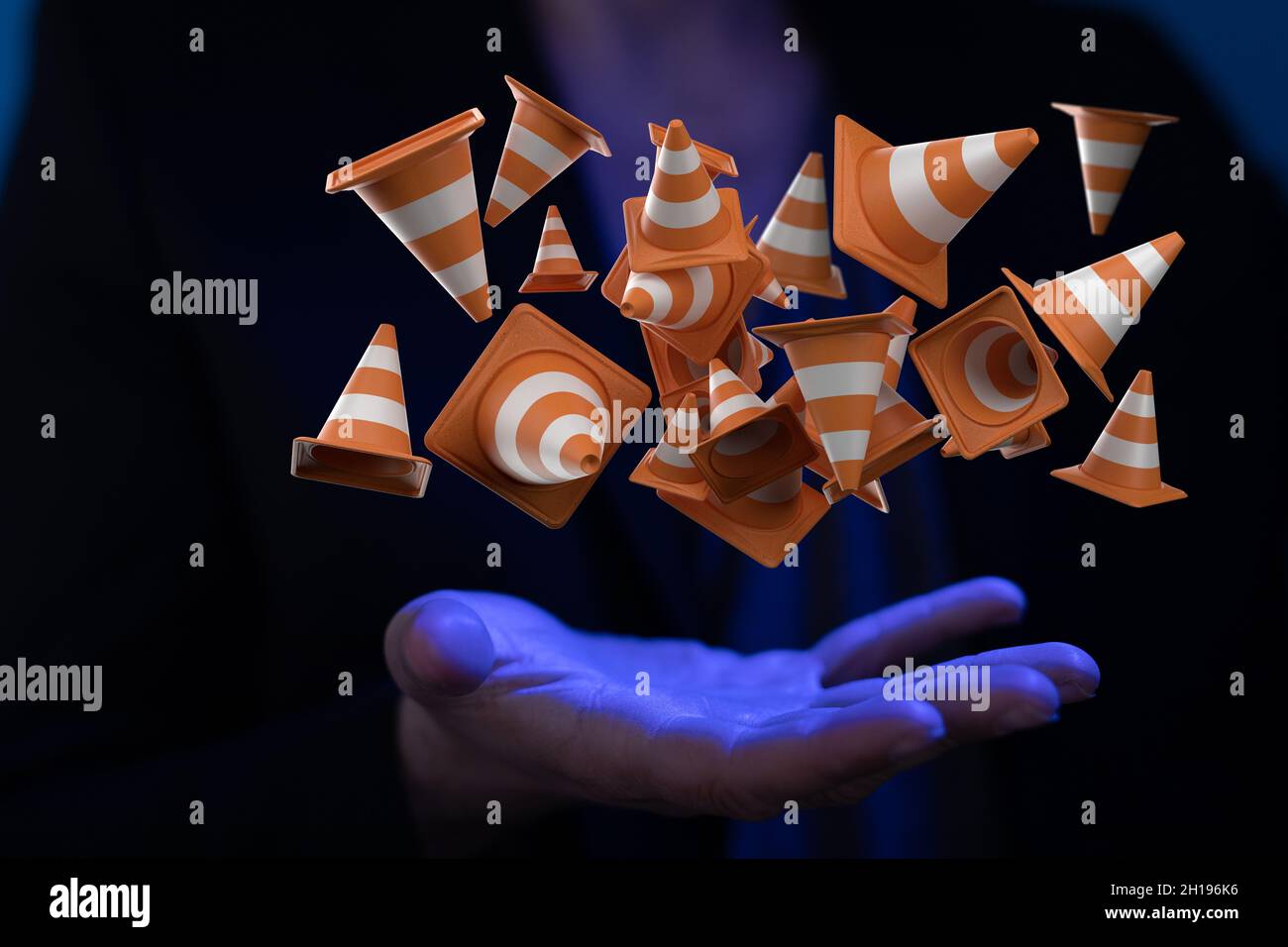 A human hand showing traffic cones under construction sign Stock Photo ...