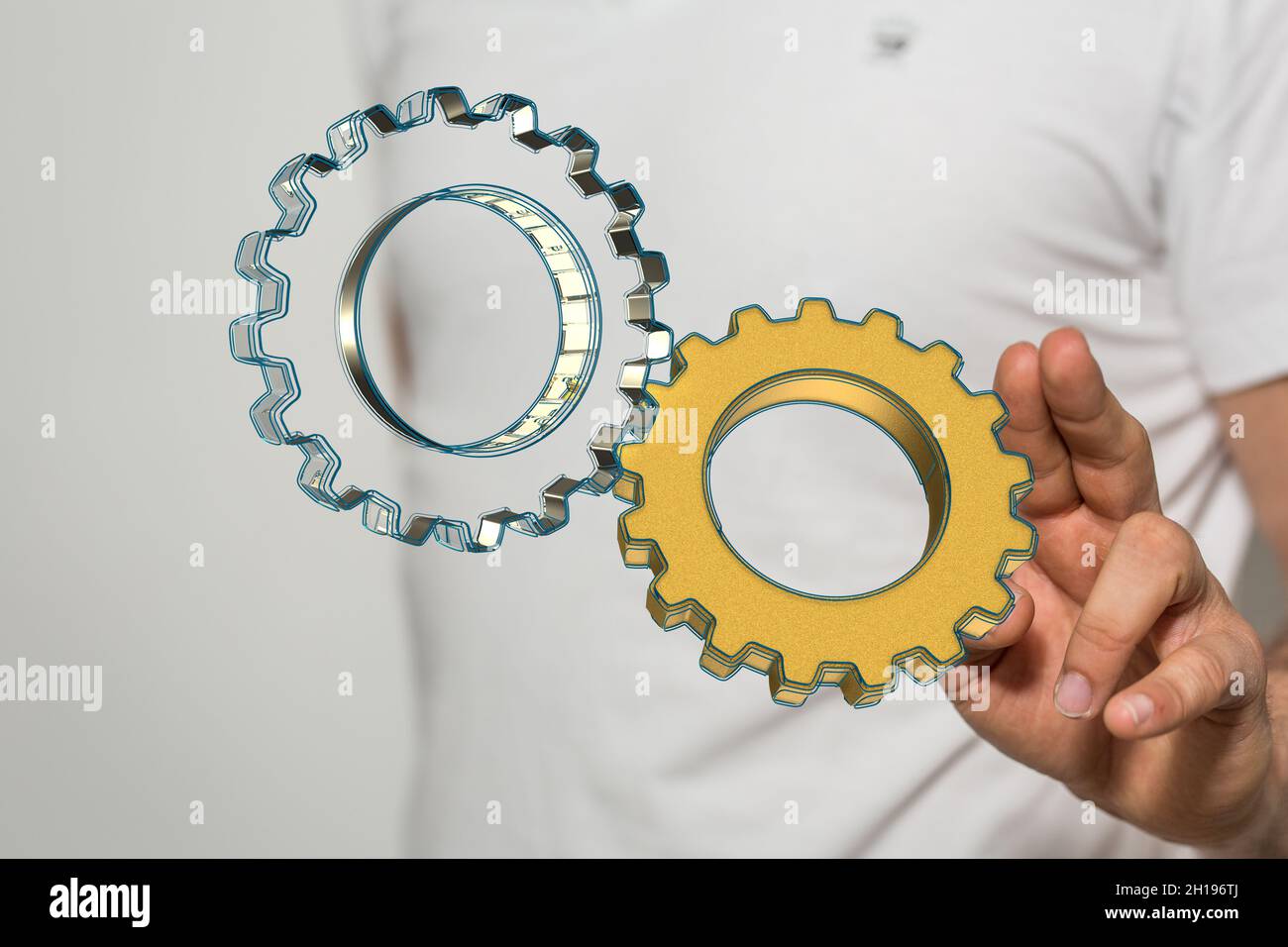 A human hand showing cogs and gear wheel mechanisms Stock Photo - Alamy