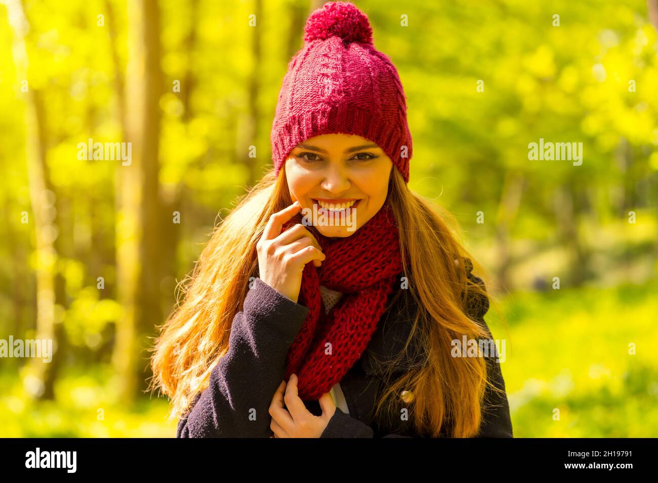A portrait of a Hispanic, redhead, smiling girl with a scarf and red ...