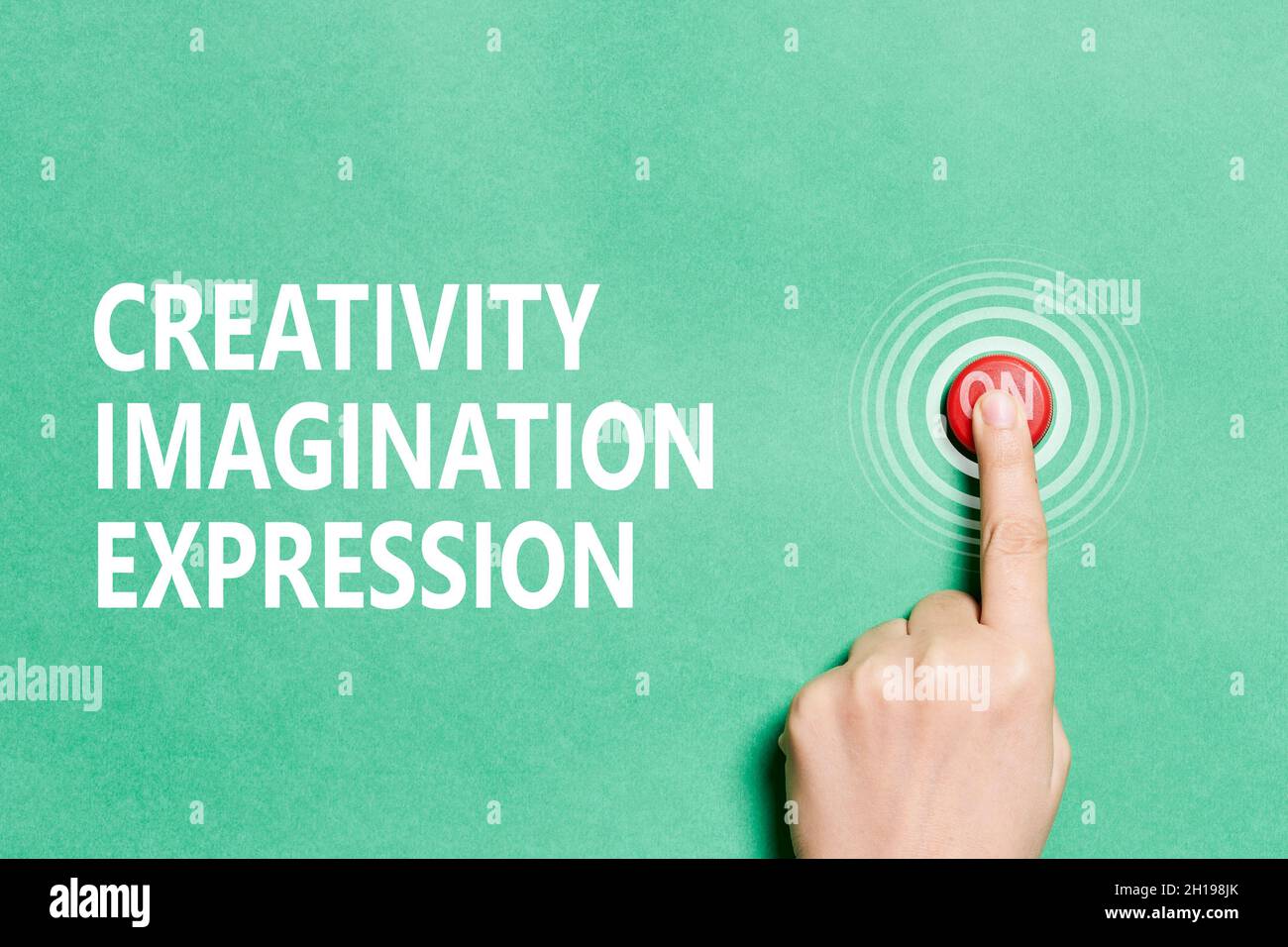 A person hand pushing red button - Switch on or Turn on creativity ...