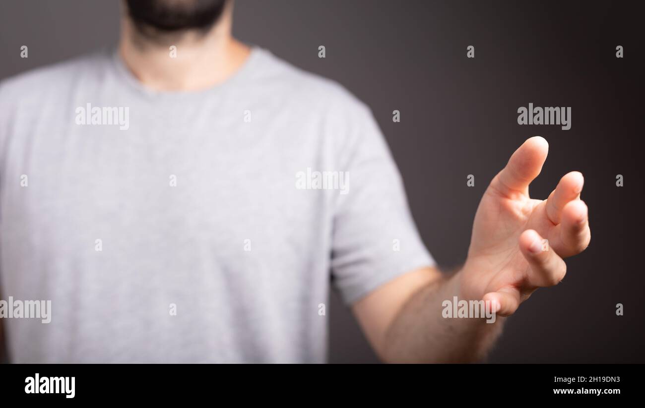 A male hand pushing on a touch screen on a black background Stock Photo ...