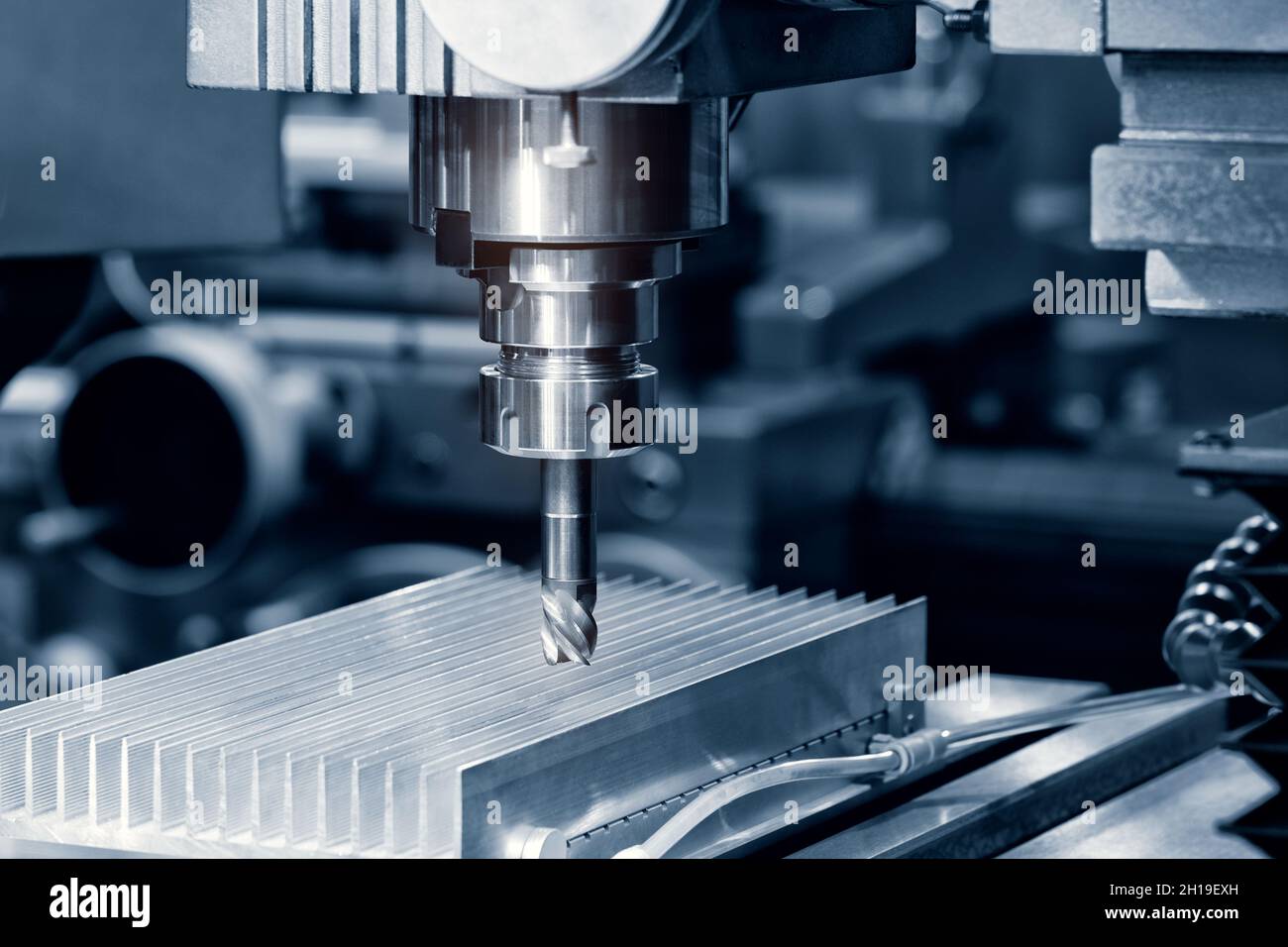 The Hi-precision CNC milling machine with cutting sample in blue-silver ...