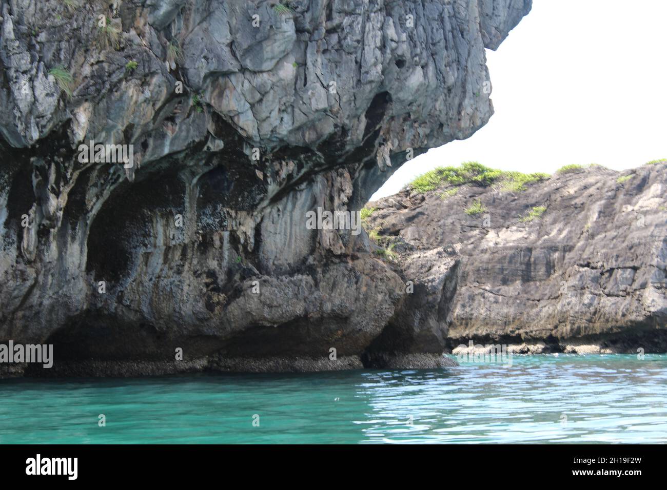 The scenic view of the huge cliff over the blue seawater Stock Photo ...